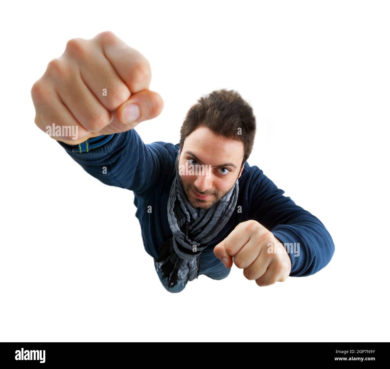 Superhero with fist thrust forward flying in the sky Stock Photo - Alamy