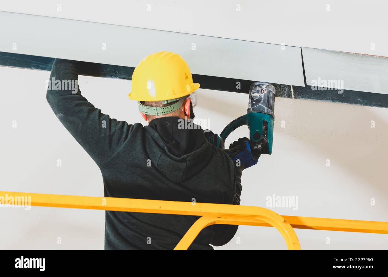 Worker at work in the construction of a plasterboard wall Stock Photo ...