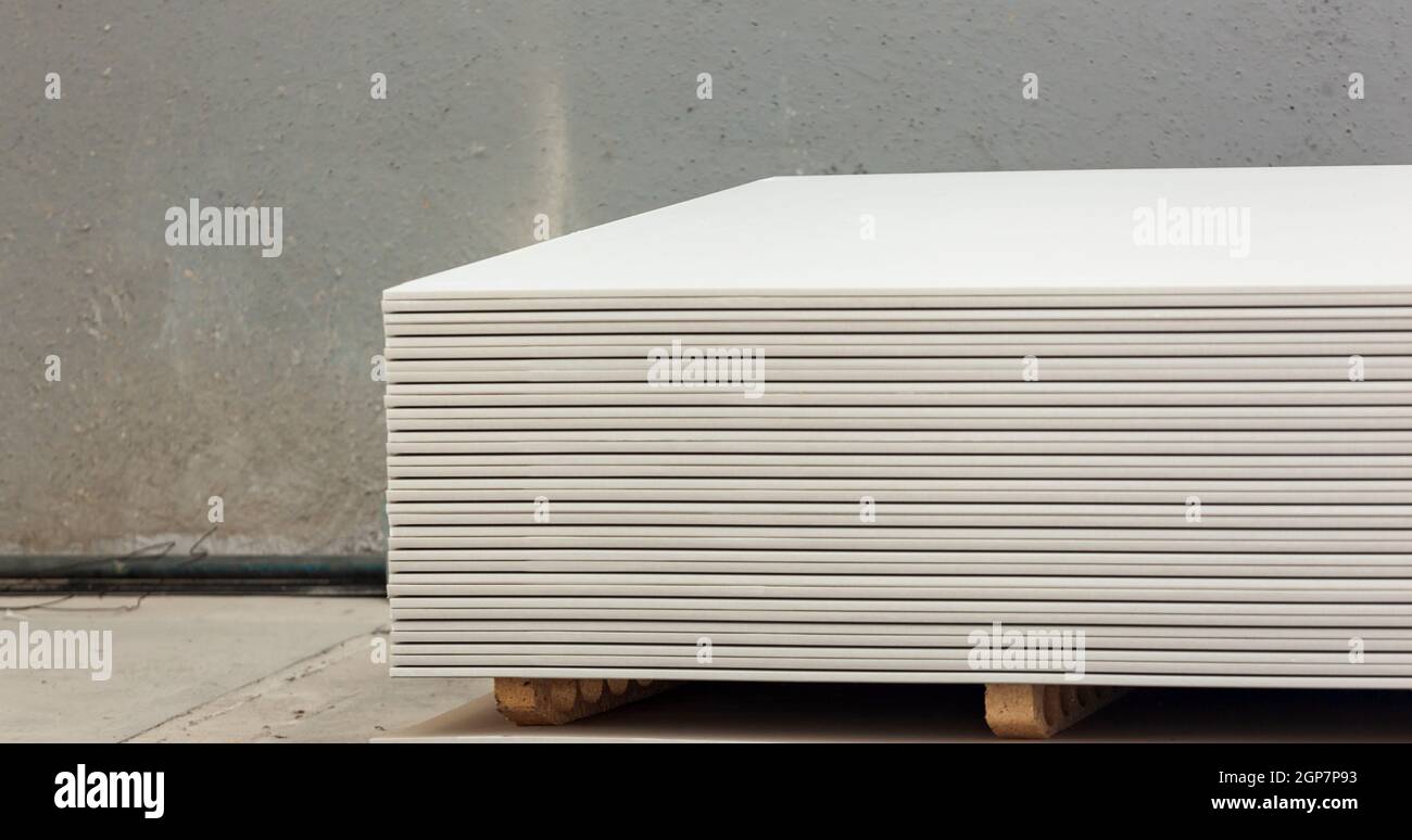 Stacking of white gypsum panels, drywall or plasterboard Stock Photo ...
