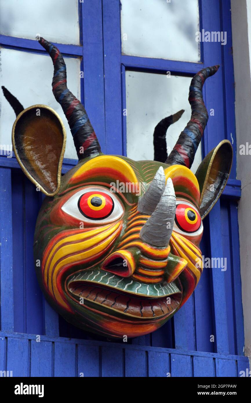 Large decorative devil masks on display in the market square of Pisac ...