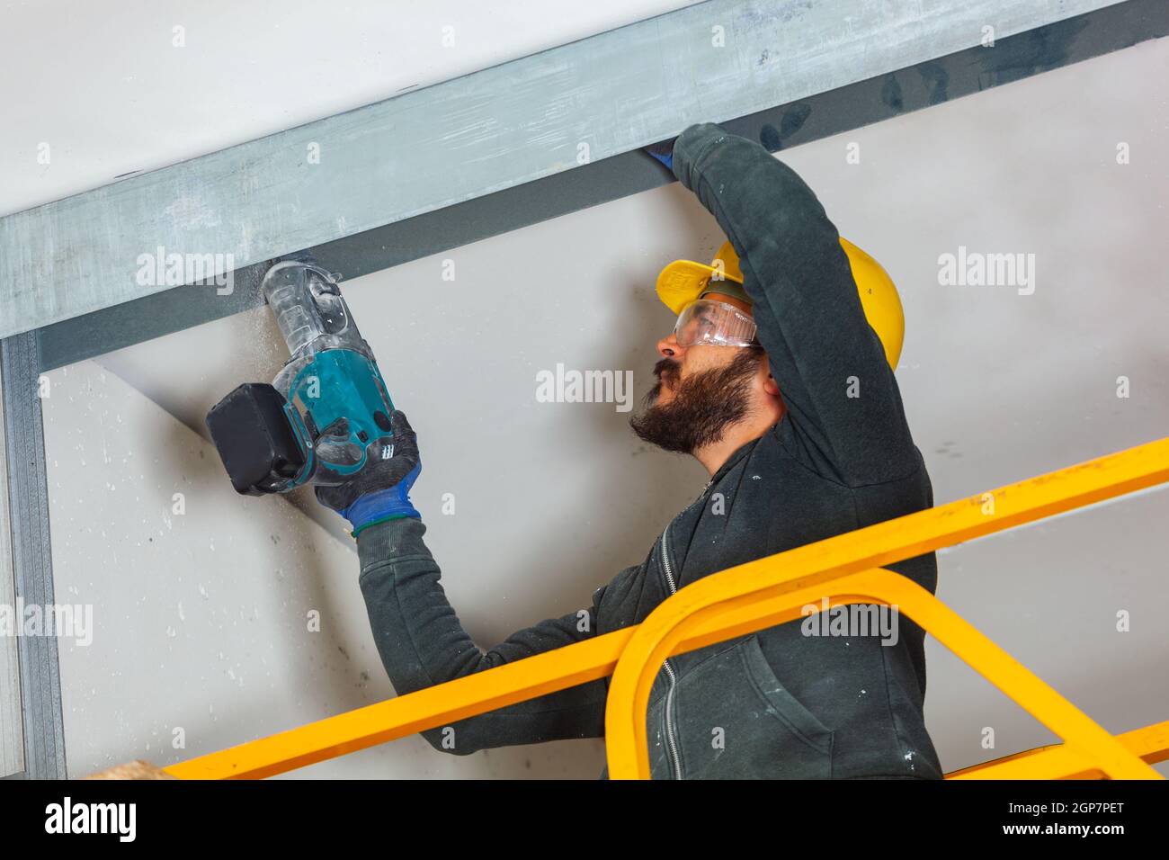 Worker at work in the construction of a plasterboard wall Stock Photo ...