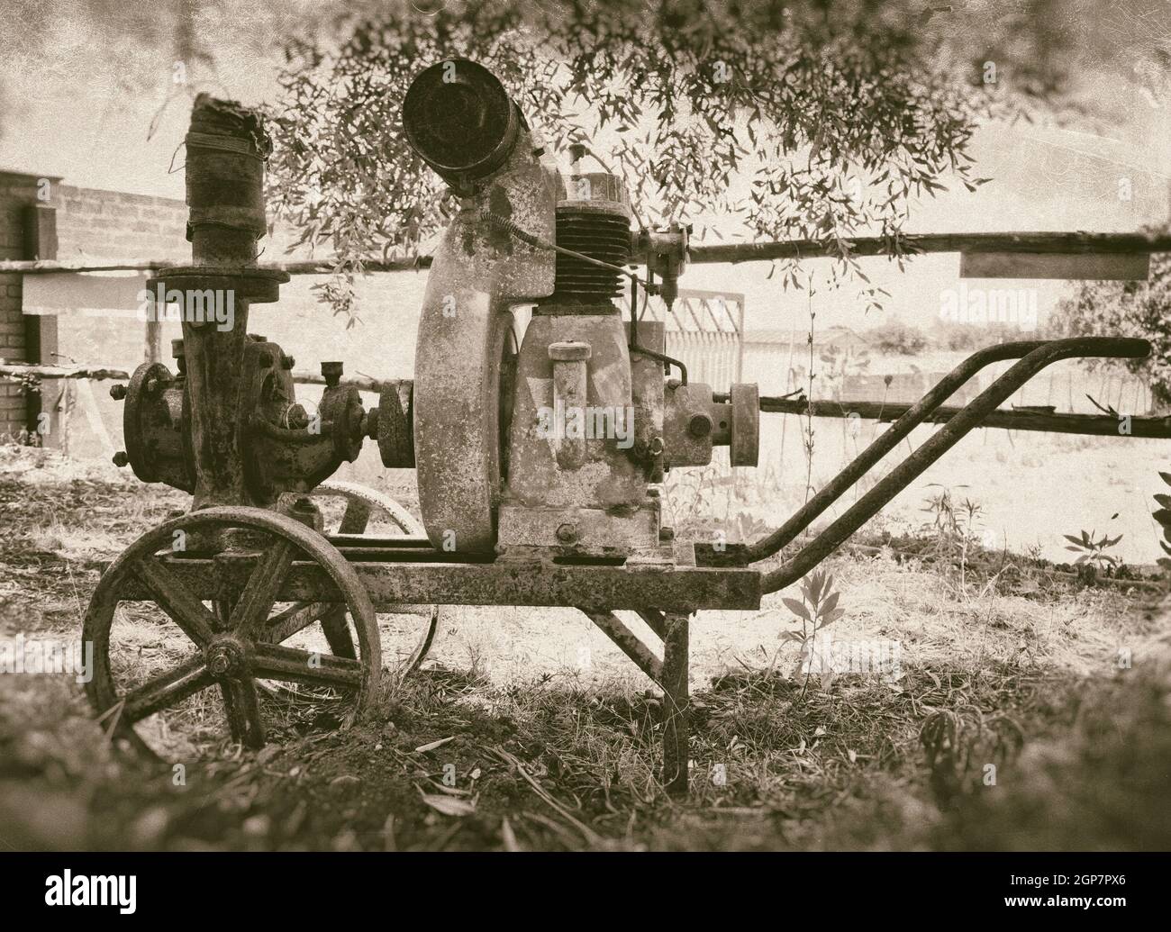 Old rusty engine for irrigation on old paper Stock Photo - Alamy