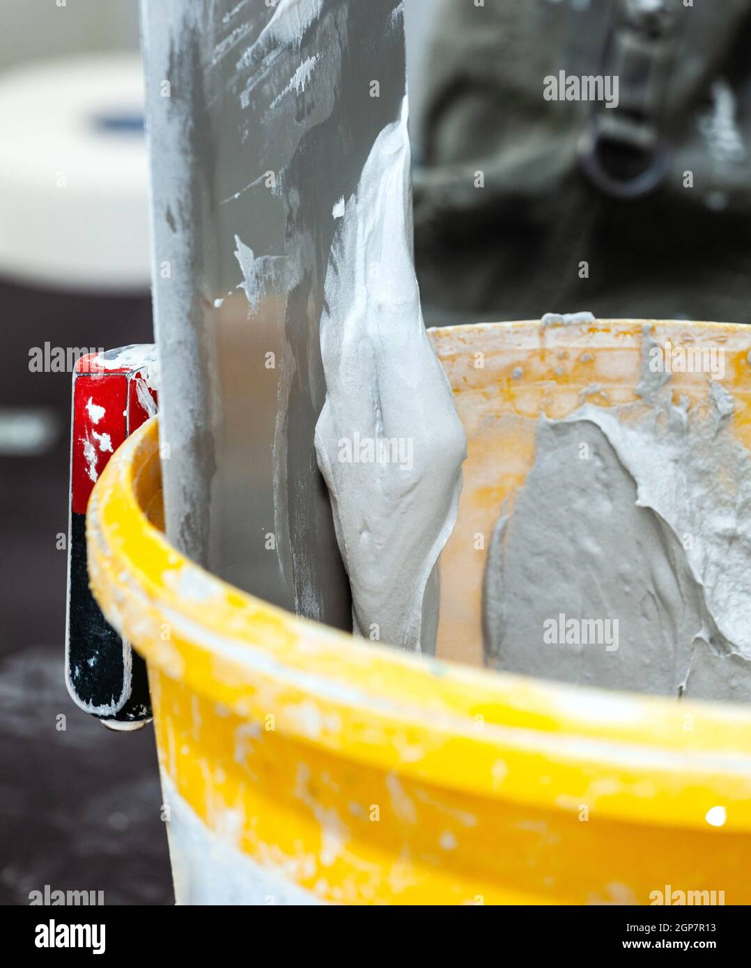 white bucket of putty coating against wall on reconstruction Stock ...