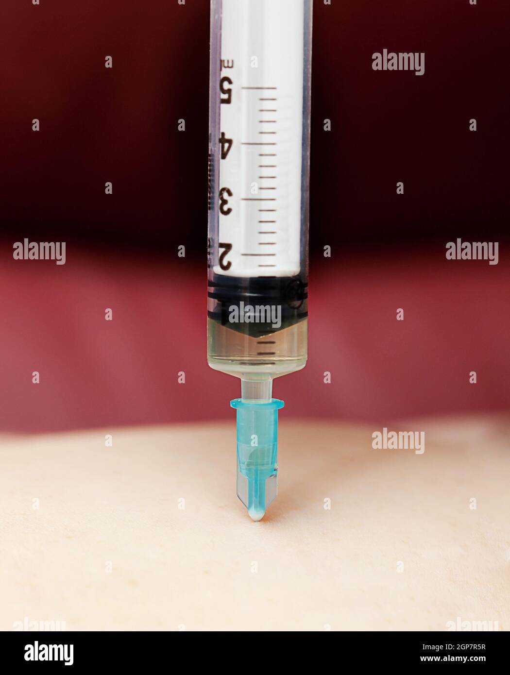 Injection syringe with medicine on the buttock Stock Photo - Alamy