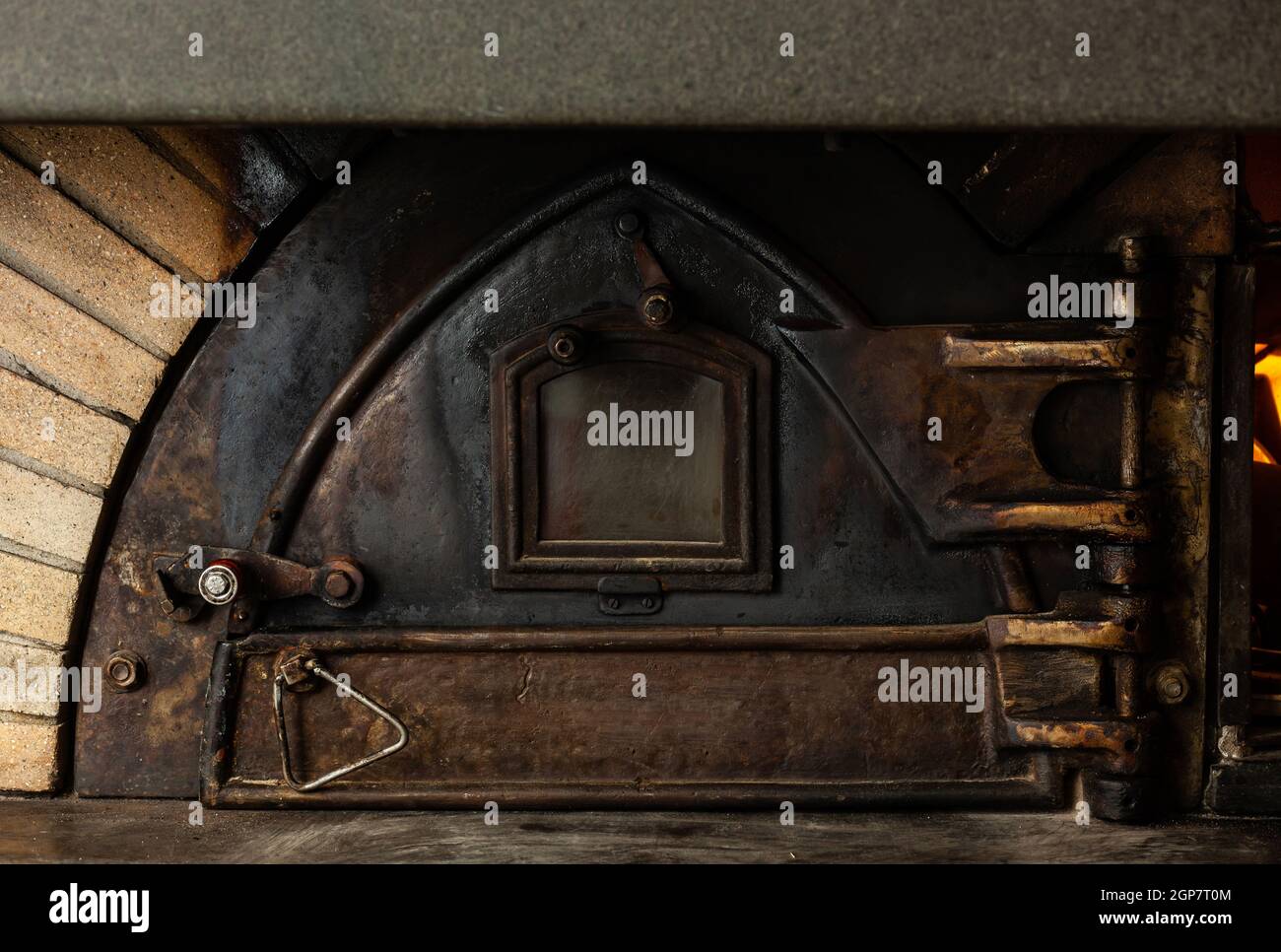 Antique wood oven with cast iron door Stock Photo - Alamy