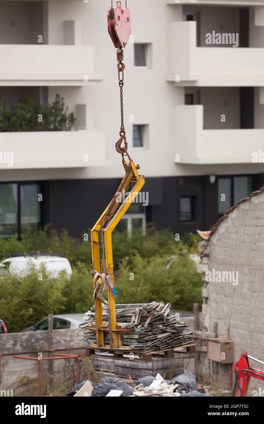 Construction site with the crane moving steel Stock Photo - Alamy