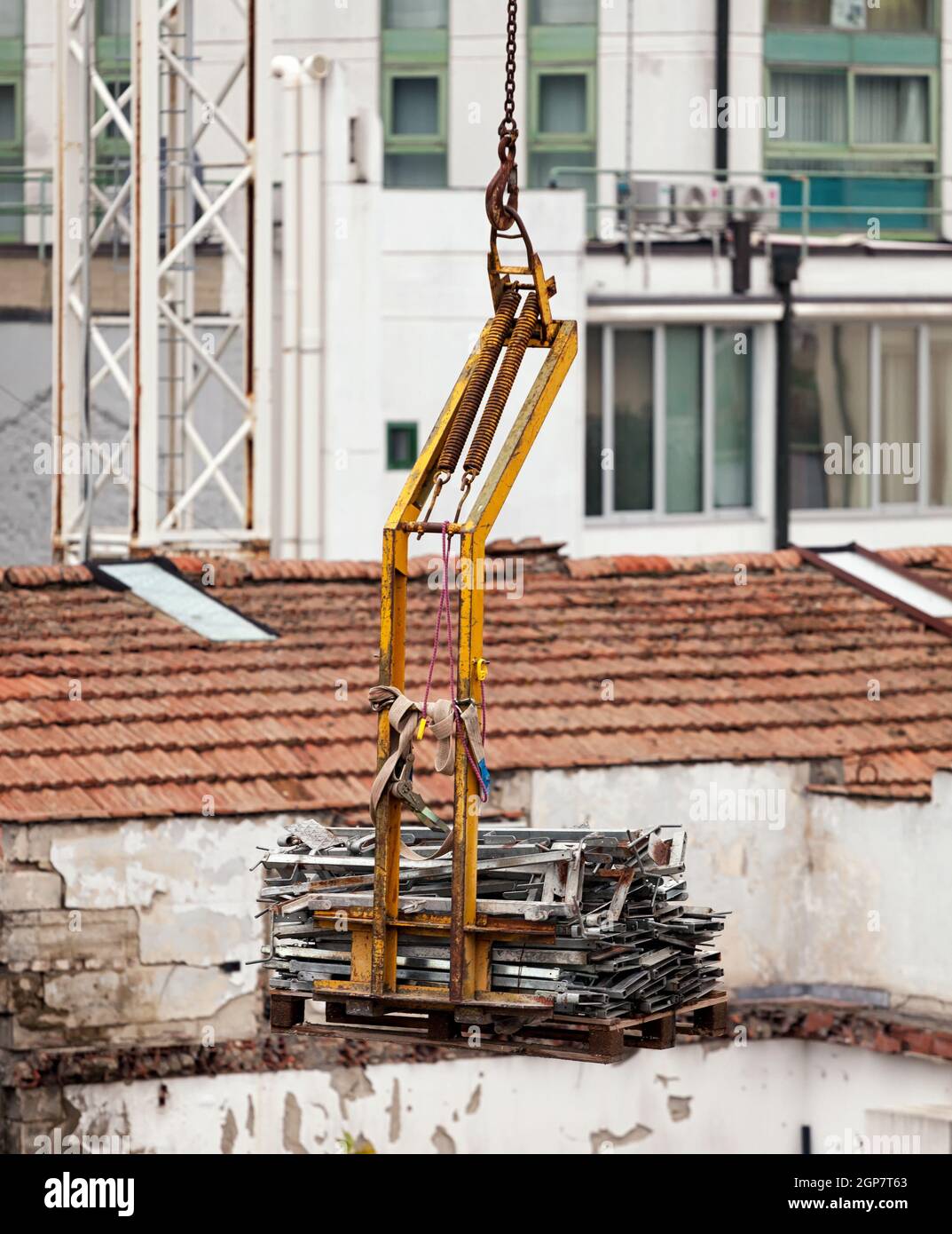 Construction site with the crane moving steel Stock Photo - Alamy