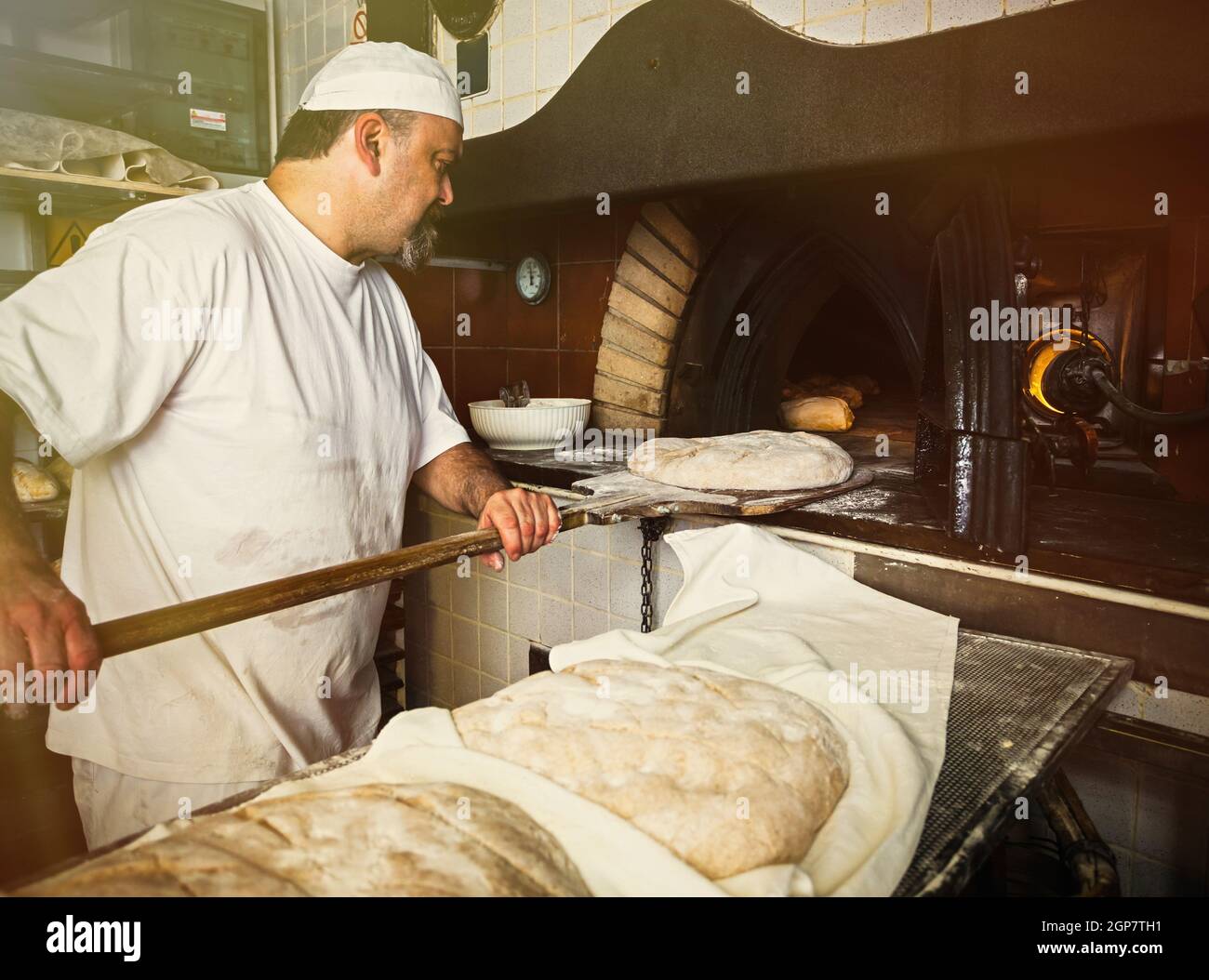 Daily production of bread baked with wood oven with traditional method ...