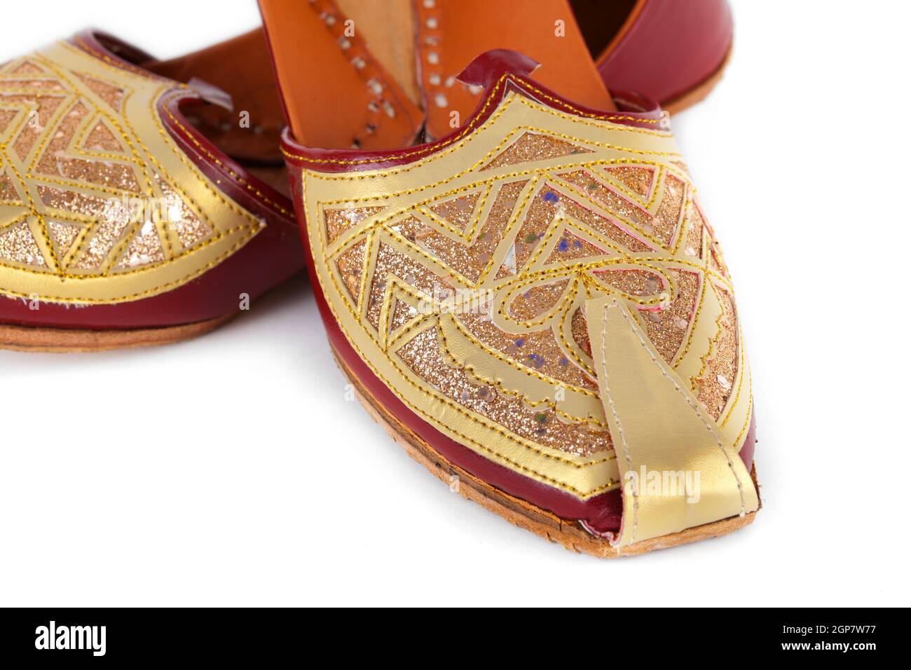 Pair of traditional Indian shoes on white background Stock Photo - Alamy