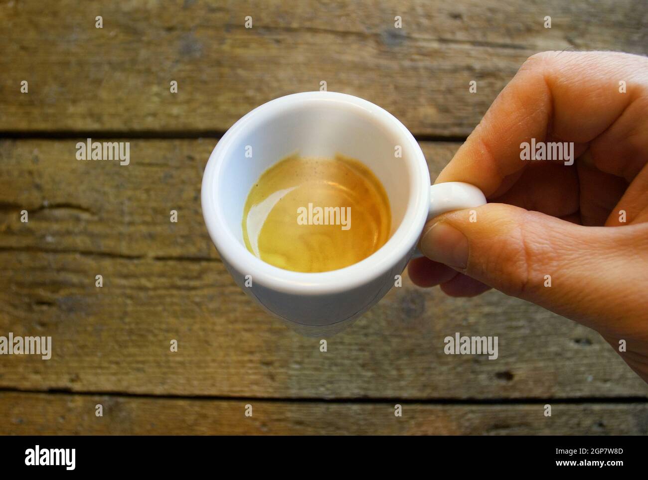 First person perspective of someone drinking from a espresso coffee cup ...