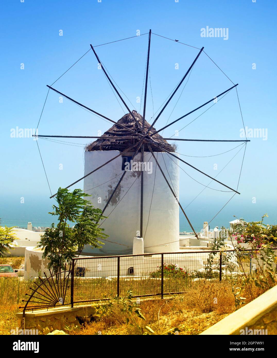 Traditional Santorini windmill against a blue sky Stock Photo - Alamy