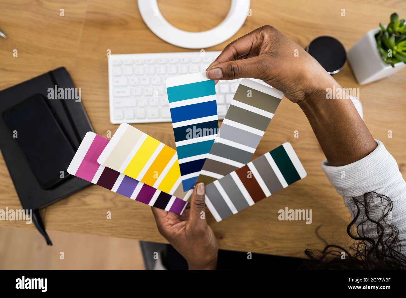 African American Graphic Designer Woman Choosing Coating Sample Stock ...