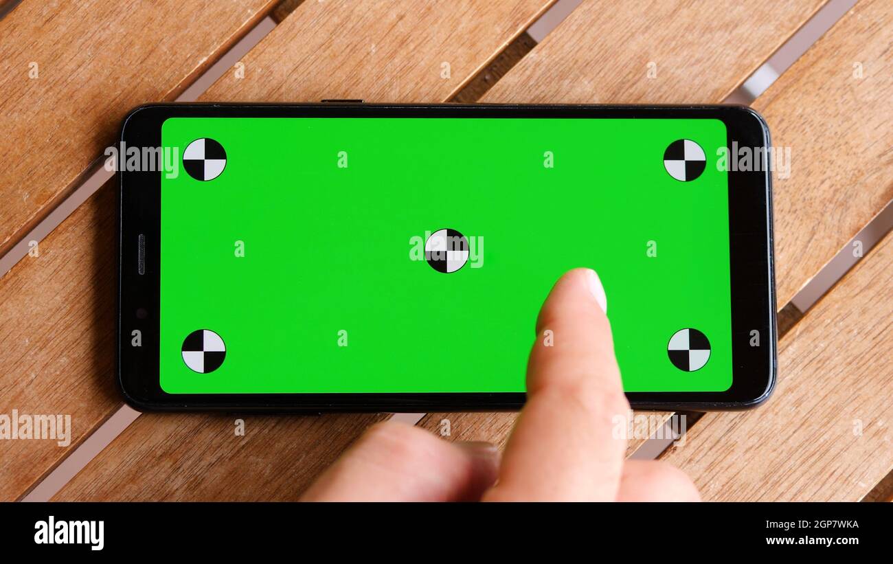 Top view smart phone place on table wood with green screen, Close-up ...