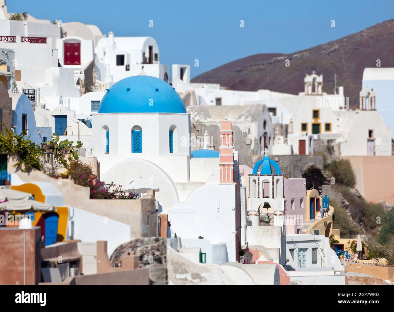 Tilt-Shift of traditional landmarks with blue cupola in Santorini ...