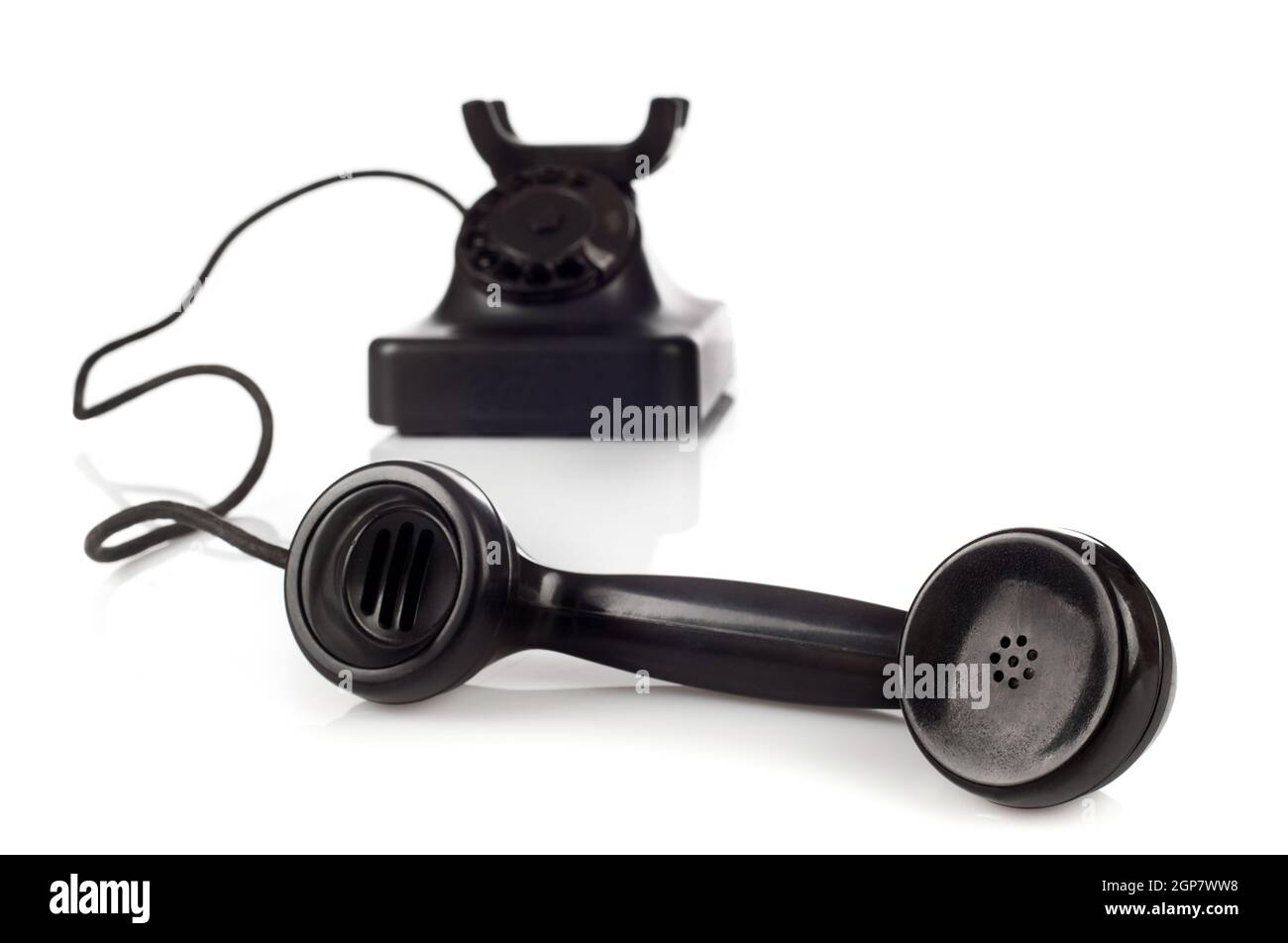 Old retro bakelite telephone on white background Stock Photo - Alamy