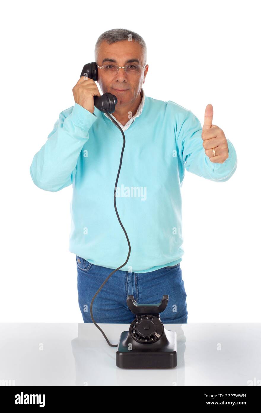 Man while talking with old bakelite telephone on white Stock Photo - Alamy