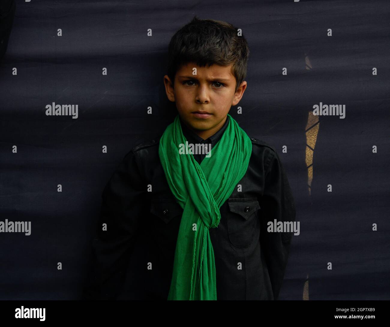 A Kashmiri Shia Muslim boy is seen while he took part in a religious ...