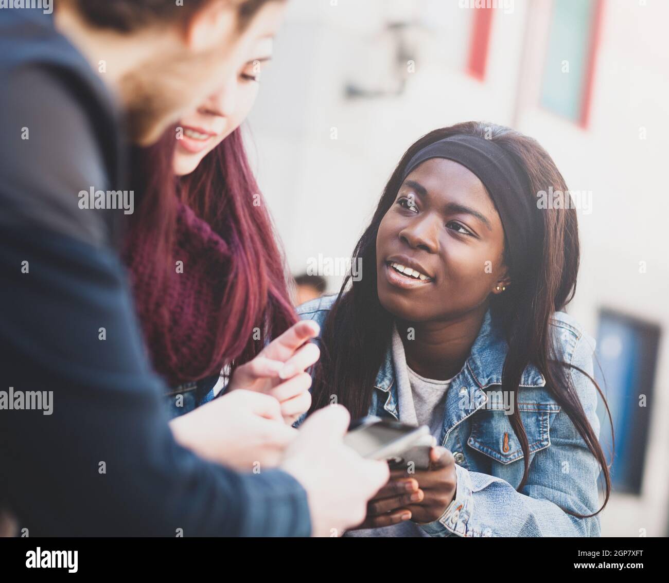 Young people using mobile hi-res stock photography and images - Alamy