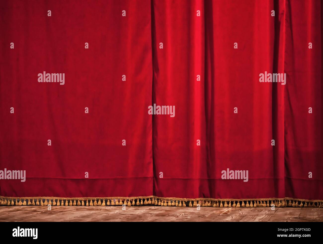Closed red stage curtain of a theater Stock Photo - Alamy
