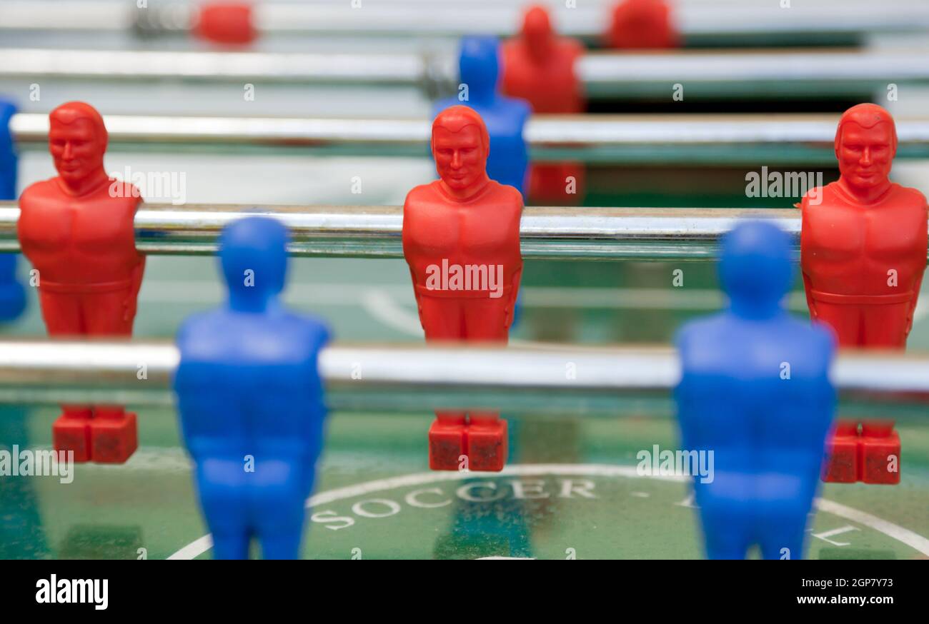 Foosball table with red and blue players Stock Photo - Alamy