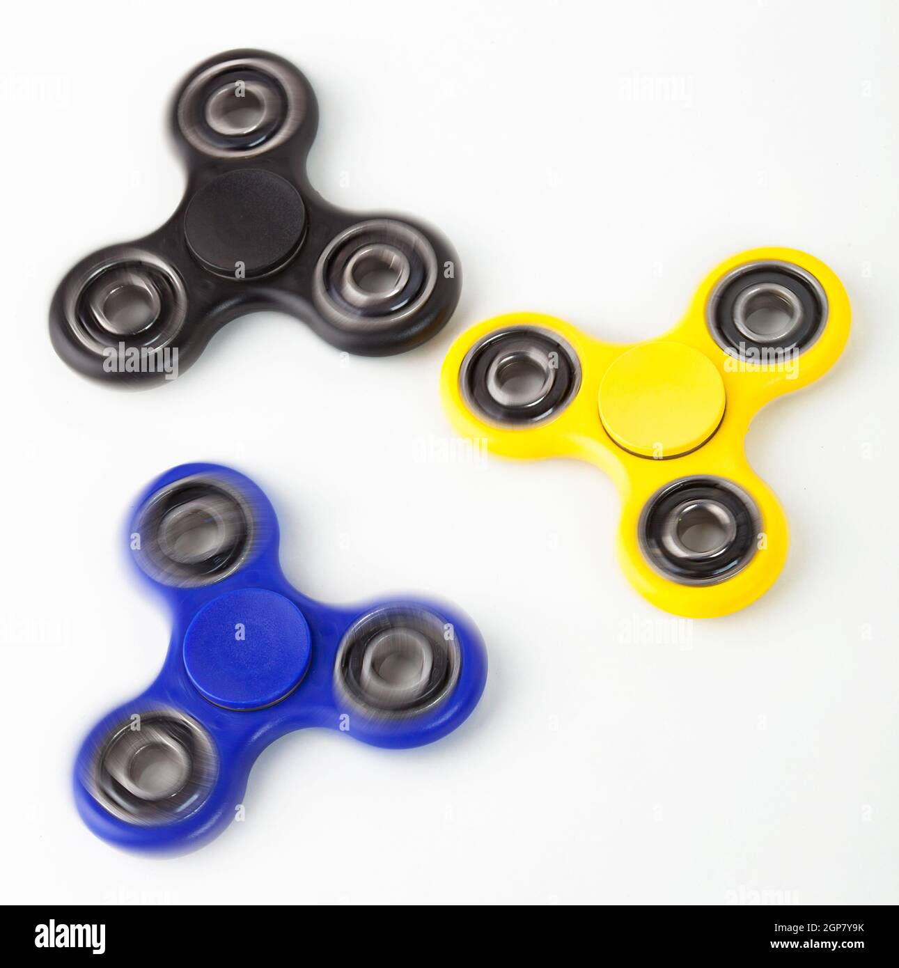 Three Fidget Spinner isolated on white background Stock Photo - Alamy