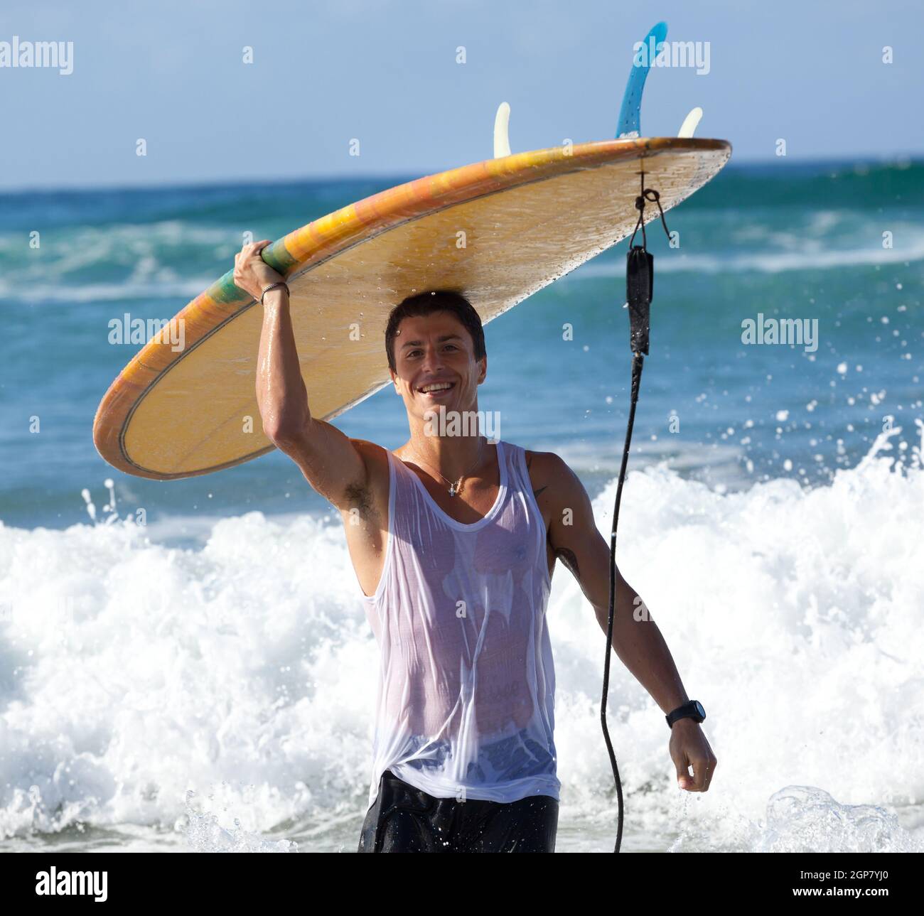 Portrait of Surfer with longboard on the beach Stock Photo - Alamy