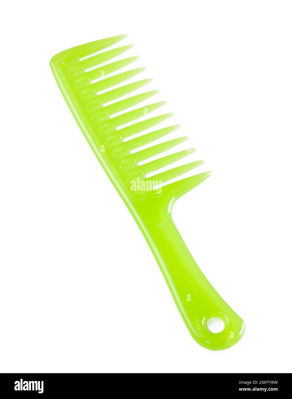Green plastic comb isolated on a white background Stock Photo - Alamy