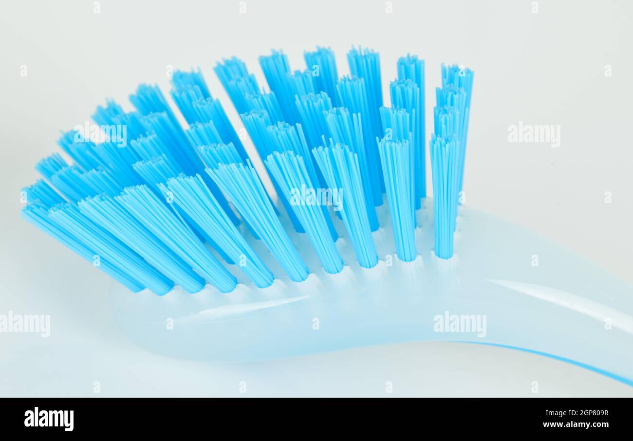 Blue plastic brush isolated on white background Stock Photo - Alamy