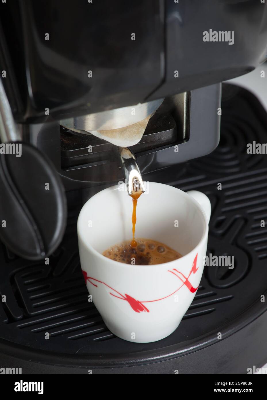 Espresso machine making coffee with paper pod Stock Photo - Alamy