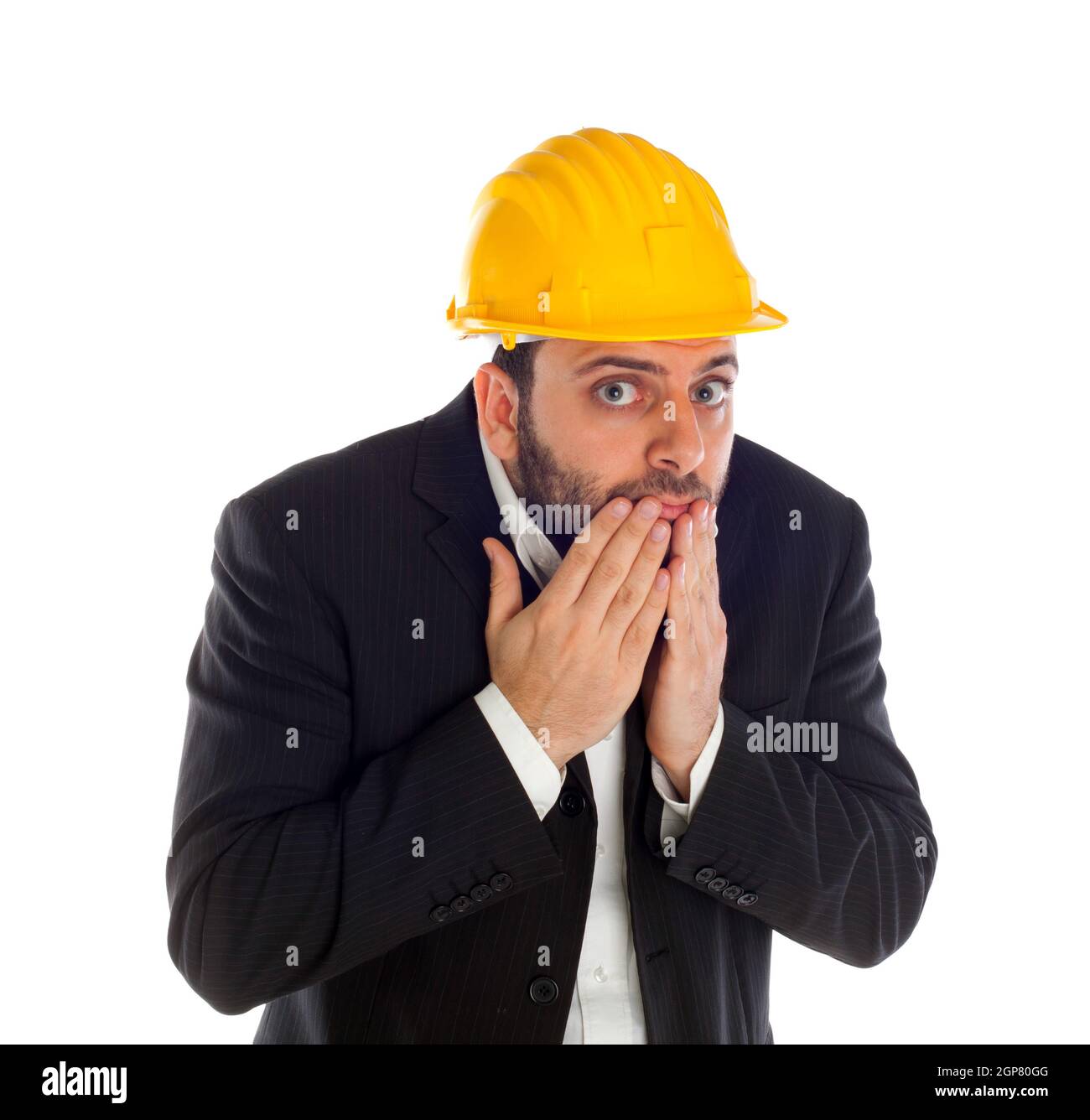 Frightened businessman with construction helmet isolated on white ...