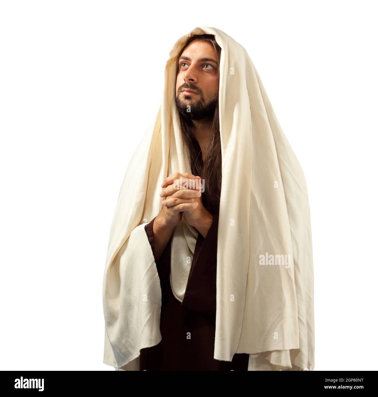 Jesus Christ prays with clasped hands turning our gaze to his father ...