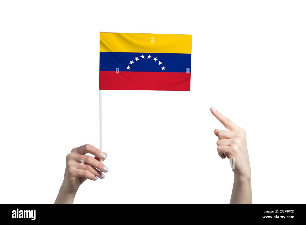 A beautiful female hand holds a Venezuela flag to which she shows the ...