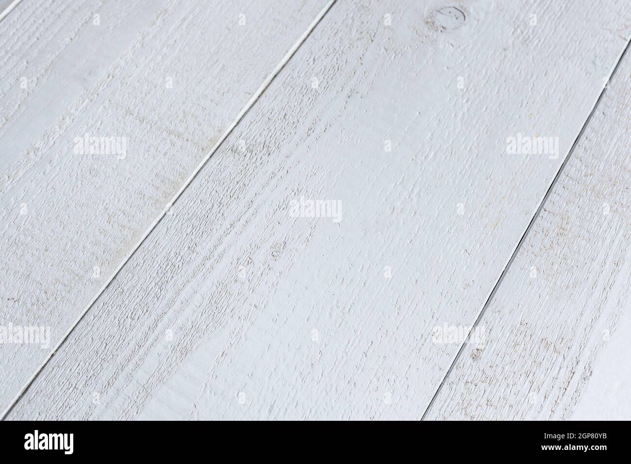 Old white wood planks in perspective. Axes diagonally, empty field for ...