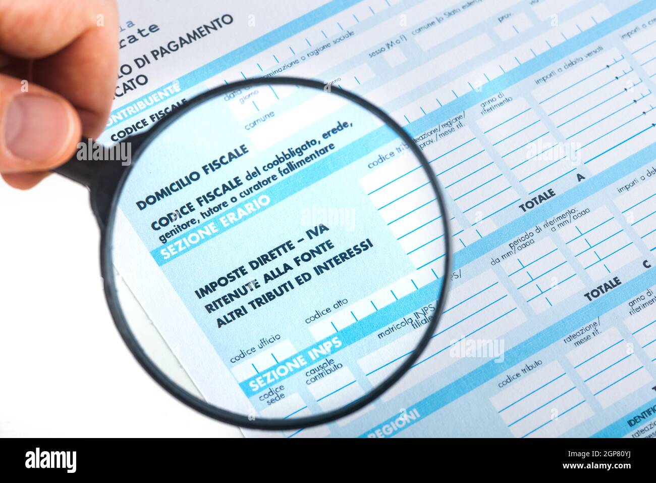 F24 for the tax return in Italy with magnifying glass Stock Photo - Alamy