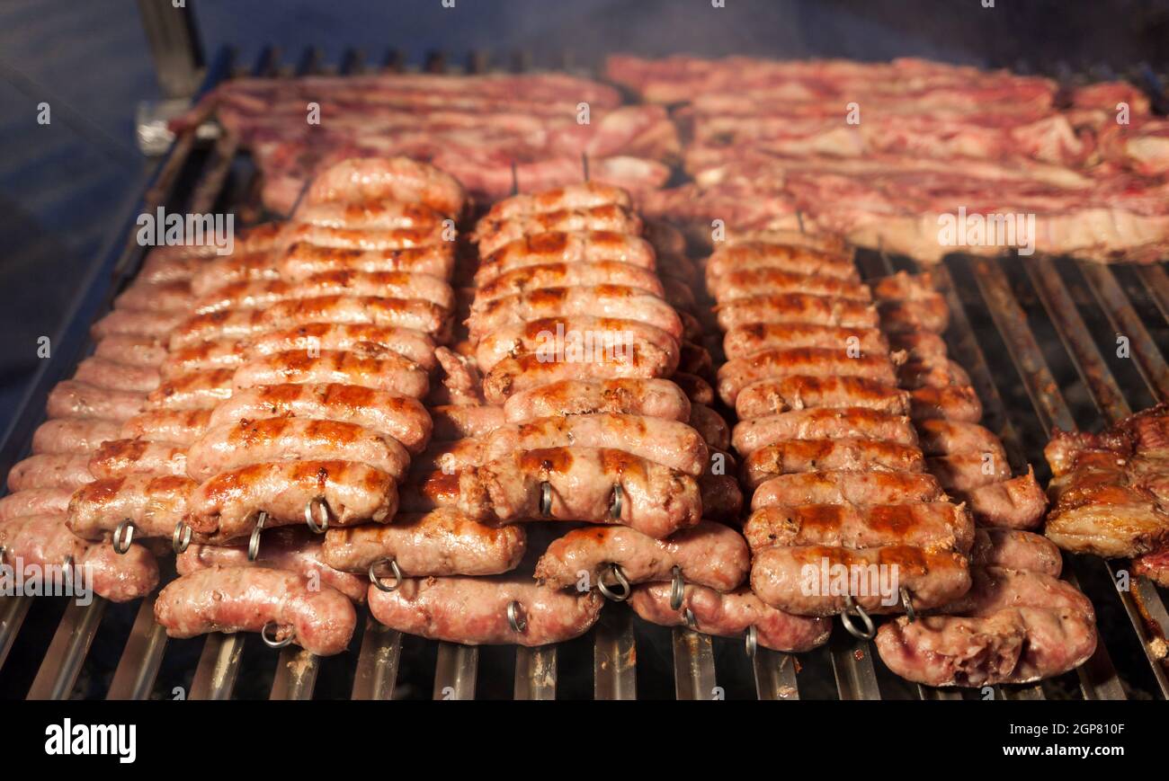 Grilled meat on a hot grill. Specialty meat sold as street food Stock ...
