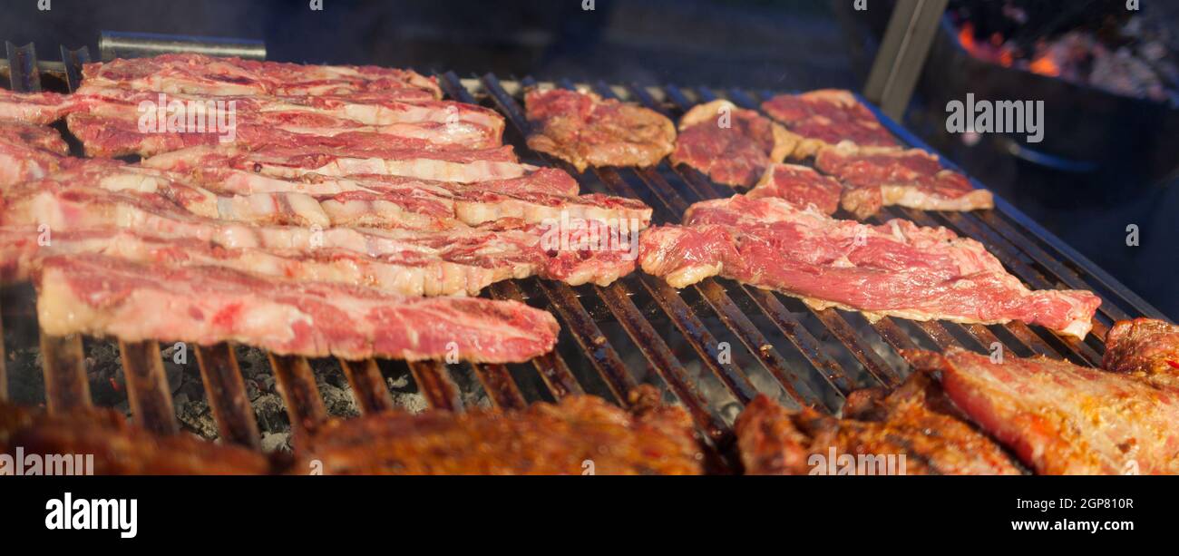 Grilled meat on a hot grill. Specialty meat sold as street food Stock ...