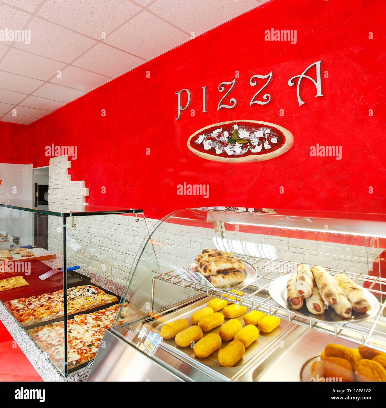 Italian style pizzeria with a showcase with fried food Stock Photo - Alamy