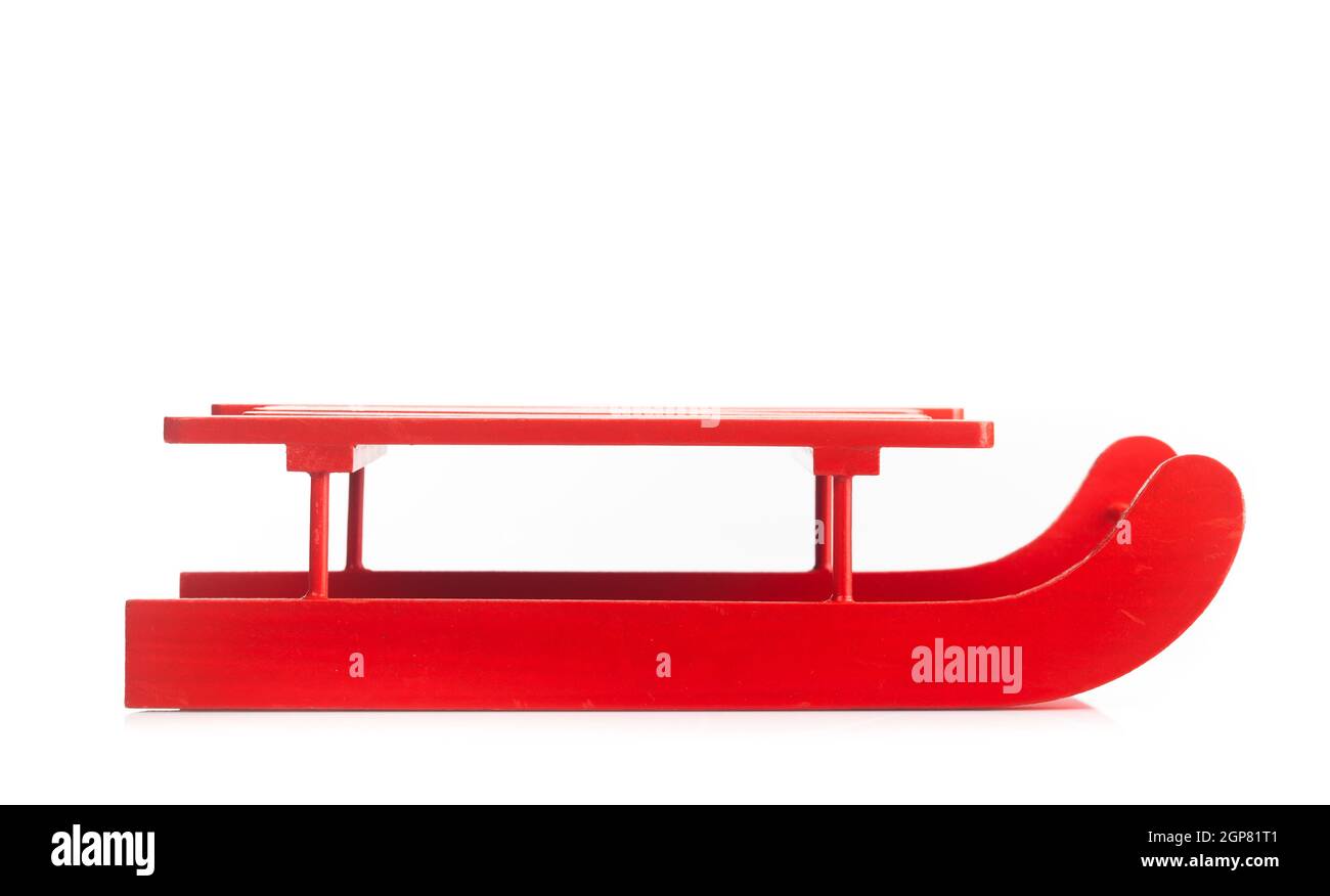 Wooden red sled isolated on white background Stock Photo - Alamy