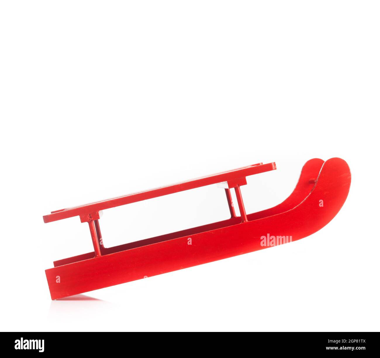 Wooden red sled isolated on white background Stock Photo - Alamy