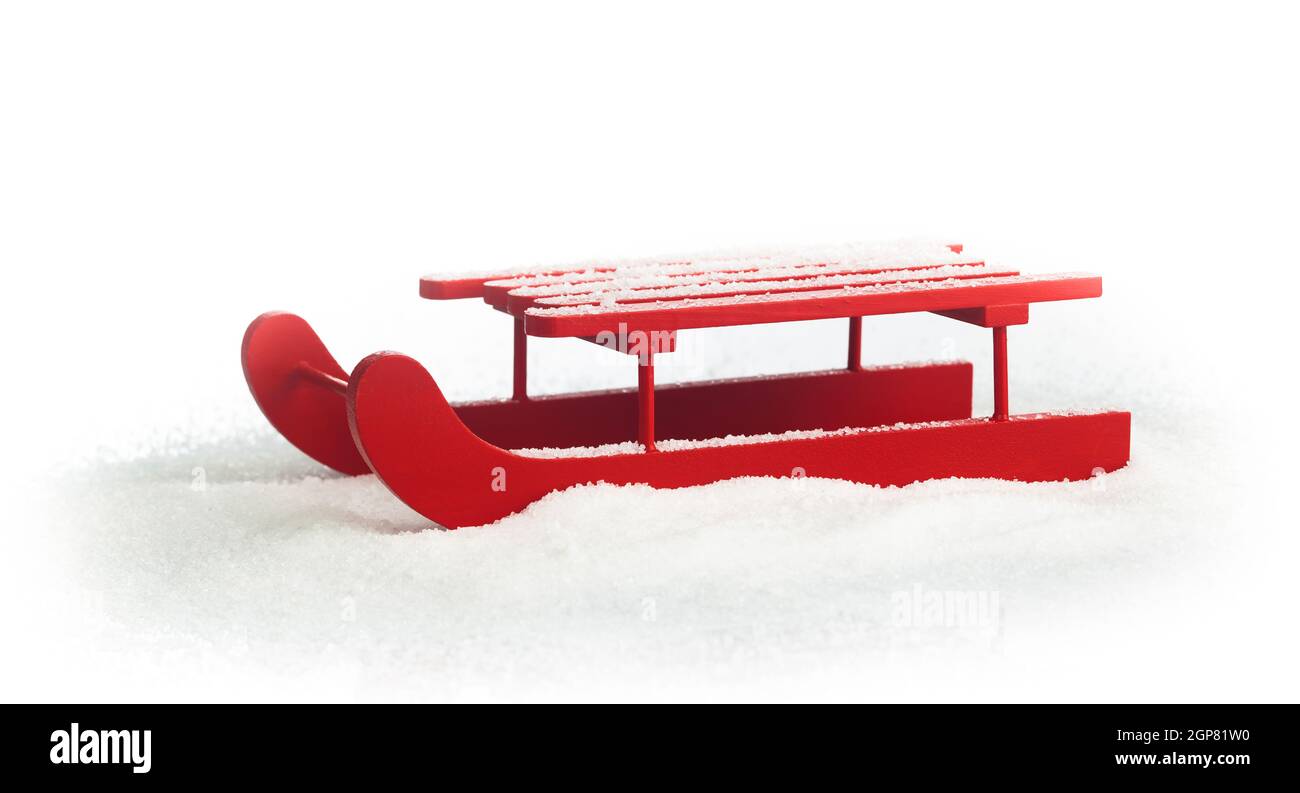 Wooden red sled isolated on white background Stock Photo - Alamy