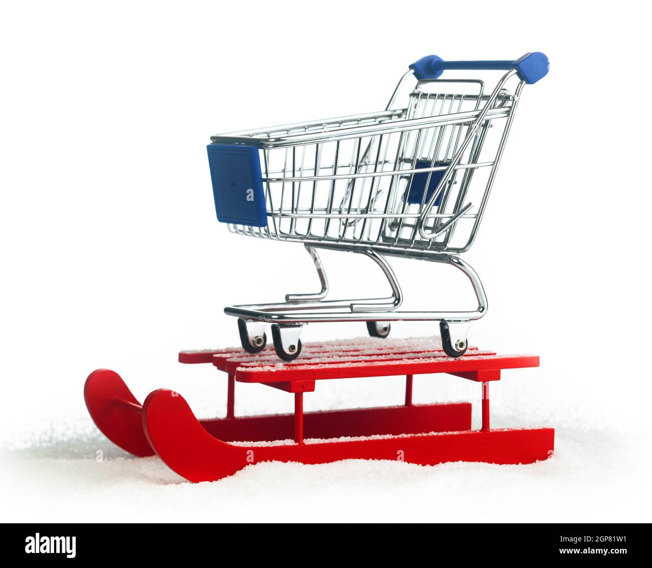 Wooden red sled with shopping cart on white background Stock Photo - Alamy