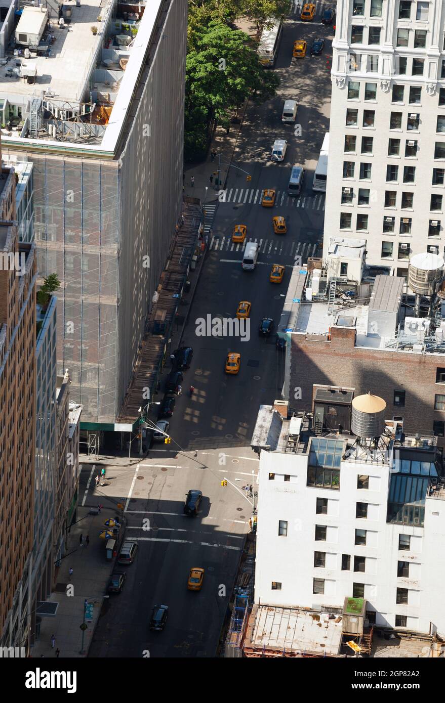 Aerial view of Manhattan streets with cars, yellow cabs and people ...