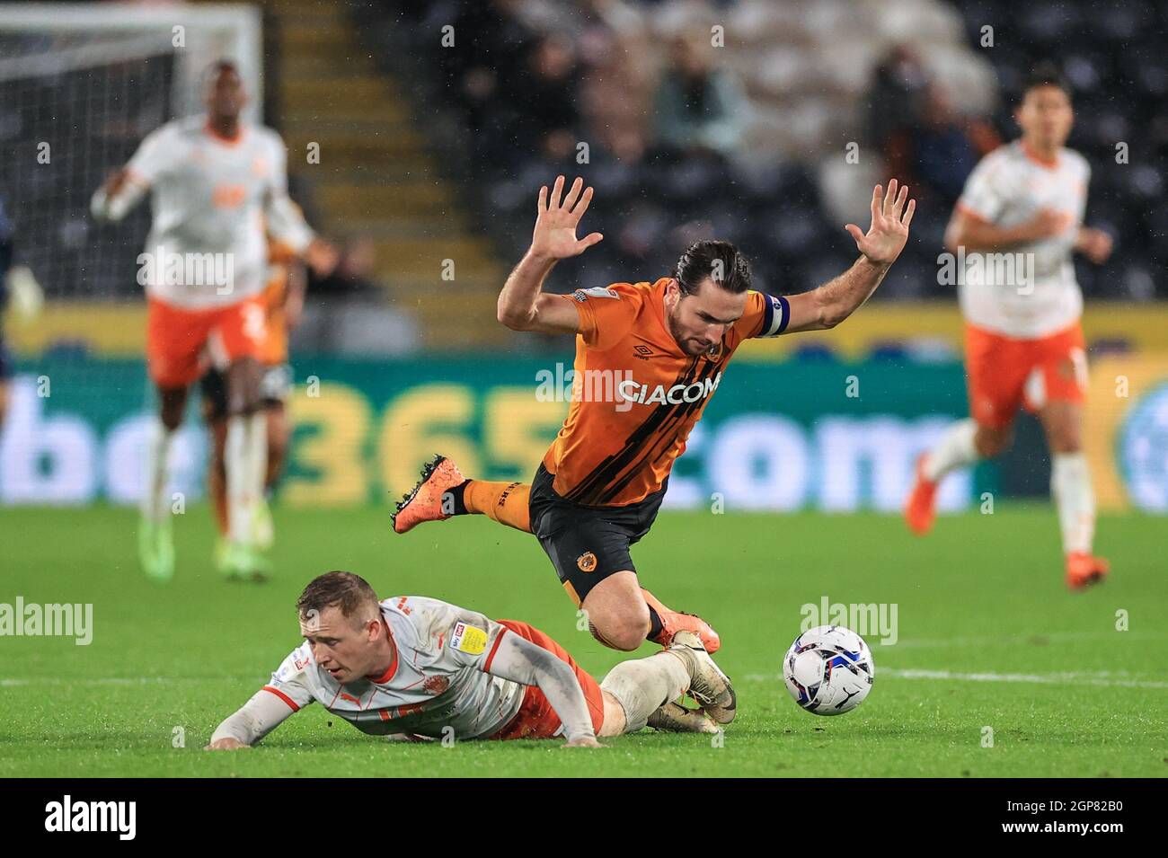 Shayne Lavery #19 of Blackpool fouled by Lewie Coyle #2 of Hull City ...