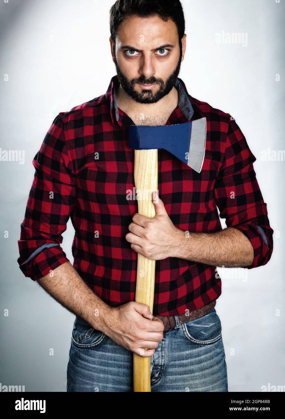 Lumberjack with plaid shirt in dark style Stock Photo - Alamy