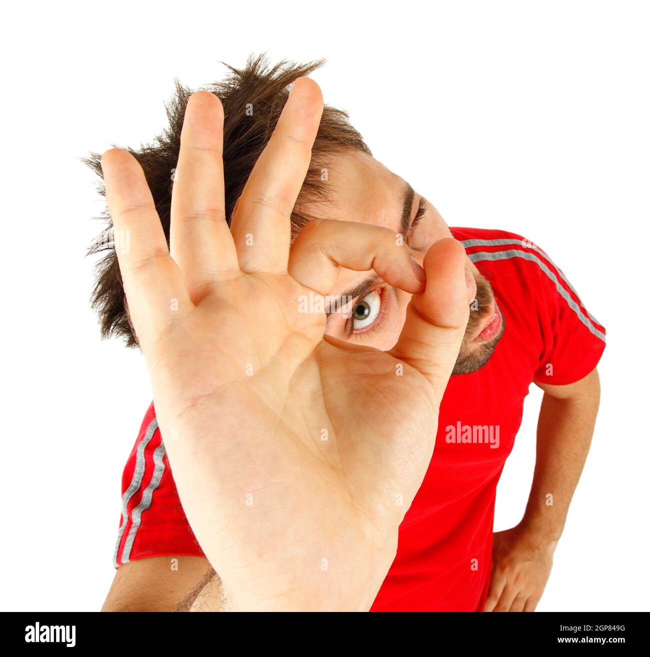 Young man with red t-shirt on white background, Ok concept Stock Photo ...