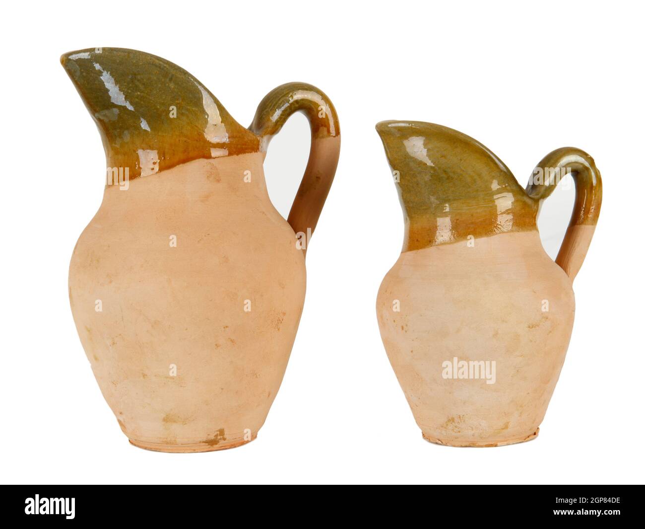 Two clay jugs isolated on white background Stock Photo - Alamy
