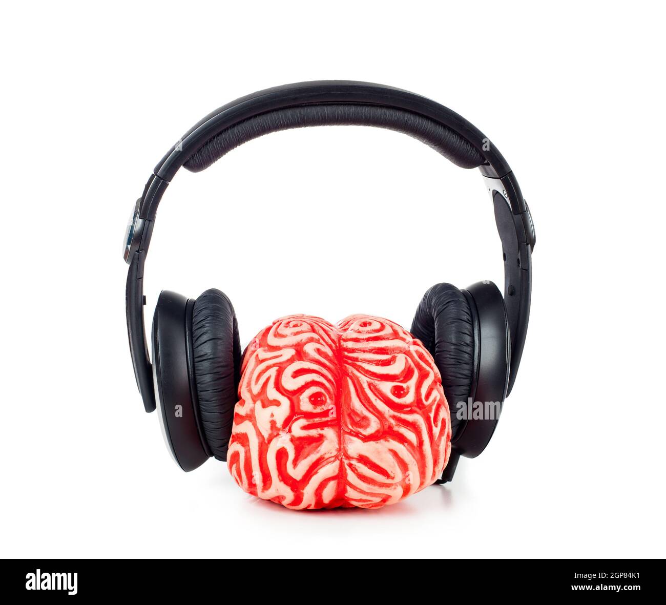 Human brain rubber with headphones on white background Stock Photo - Alamy