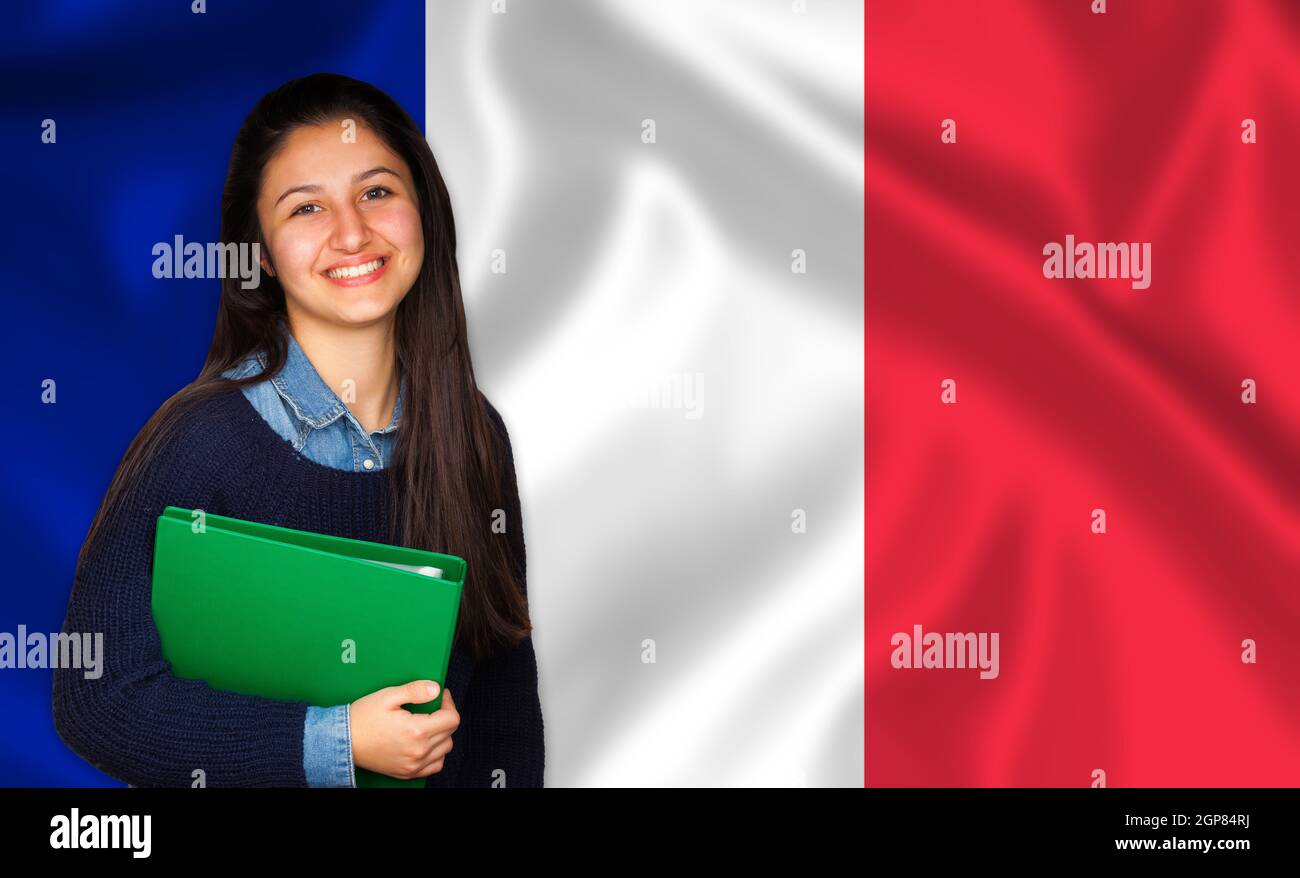 Teen student smiling over French flag. Concept of lessons and learning ...