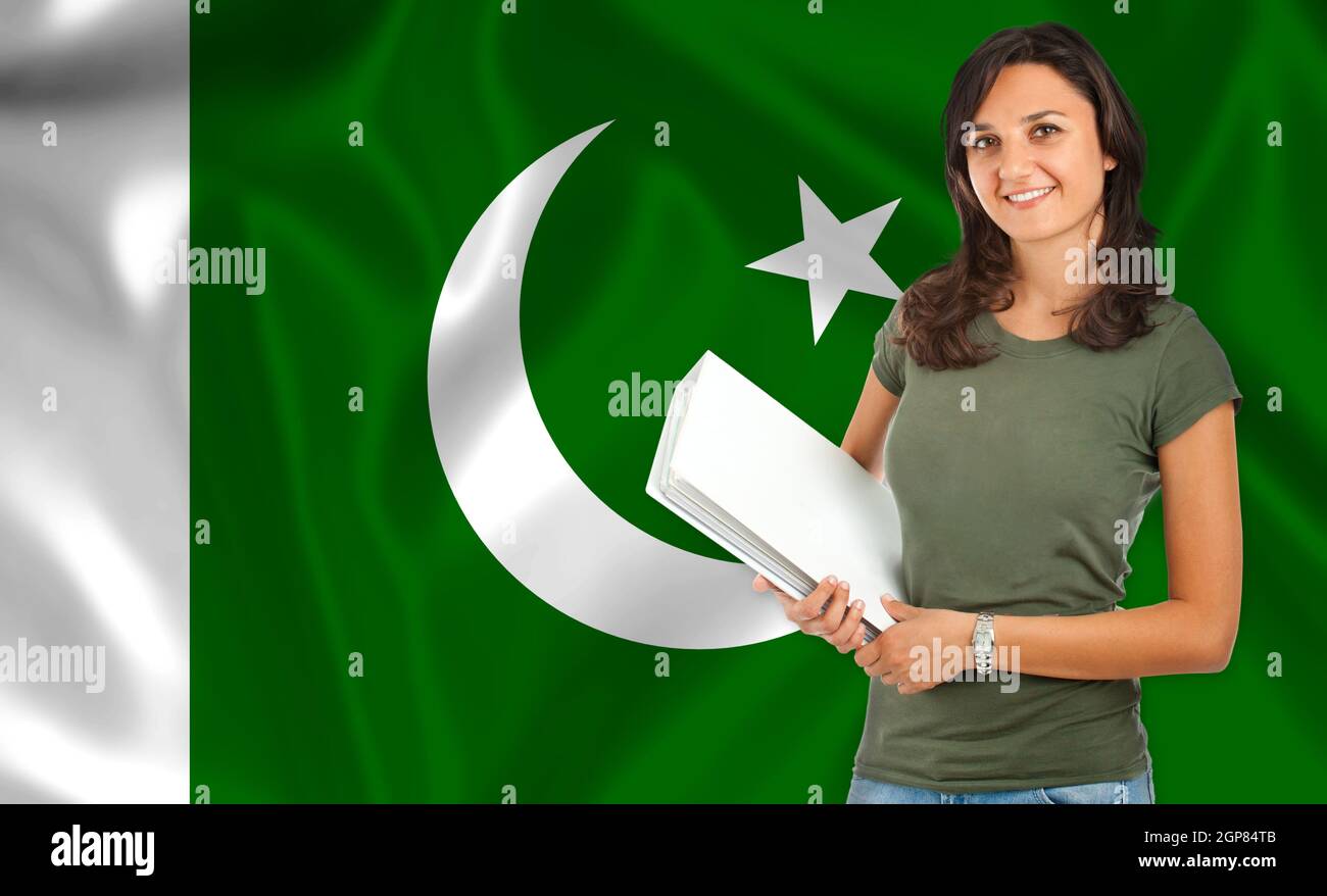 Young female student smiling over Pakistani flag Stock Photo - Alamy