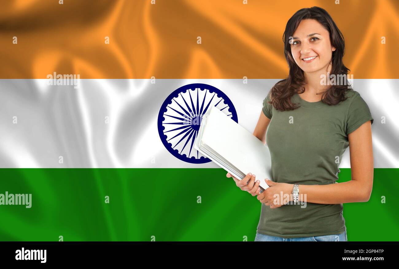 Young female student smiling over Indian flag Stock Photo - Alamy
